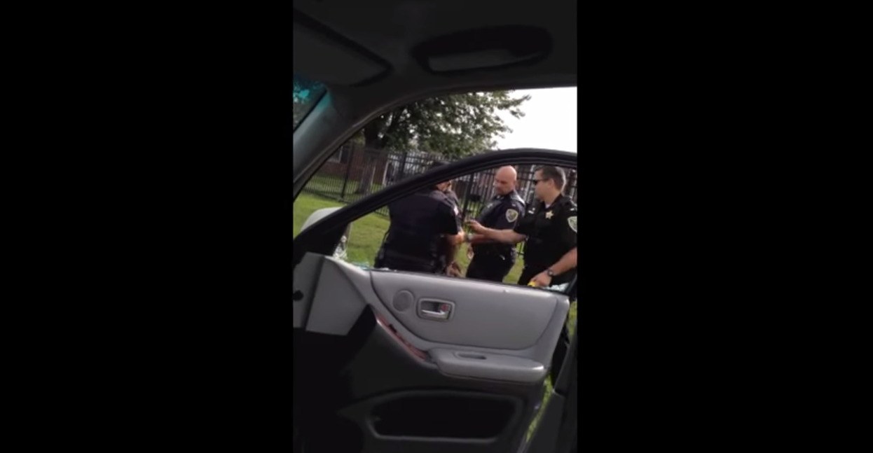Video Shows Police Smash a Car Window, Taser Passenger As Children Watch